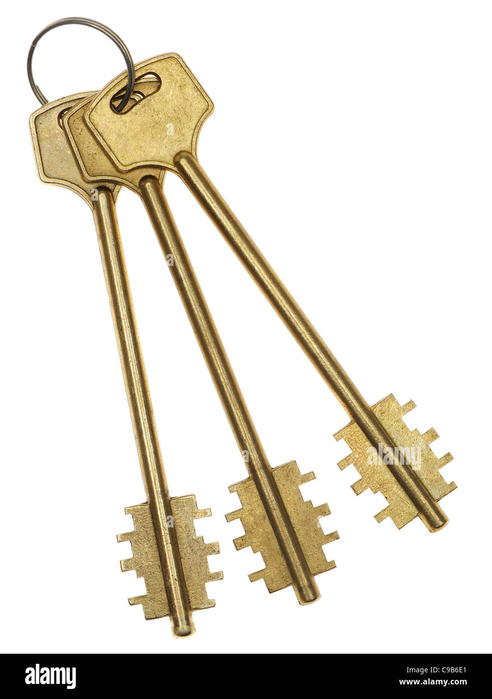 Three gold keys. It is isolated on a white background Stock Photo - Alamy