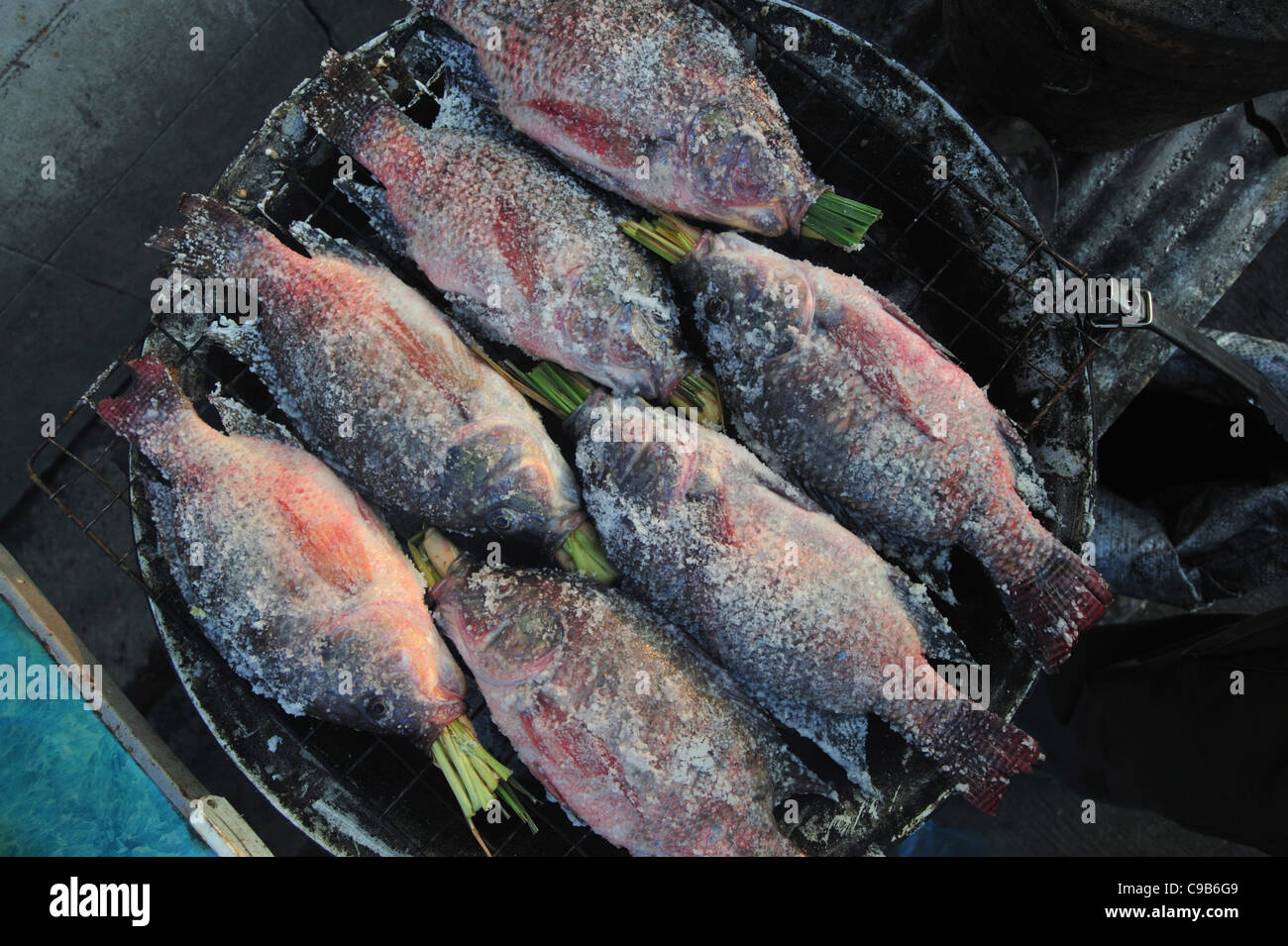 Charcoal grilled salt-crusted fish stuffed with lemongrass (Pla Pao ...