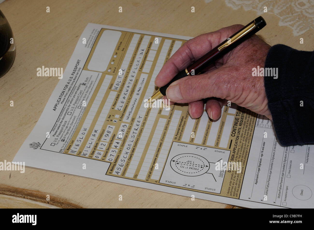 Completing An Application Form For A US Passport Stock Photo Alamy