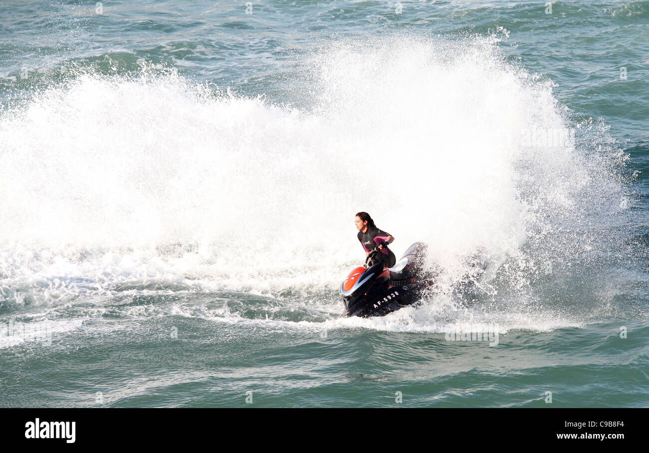 A Jet Skier jumping waves. Picture by James Boardman Stock Photo - Alamy