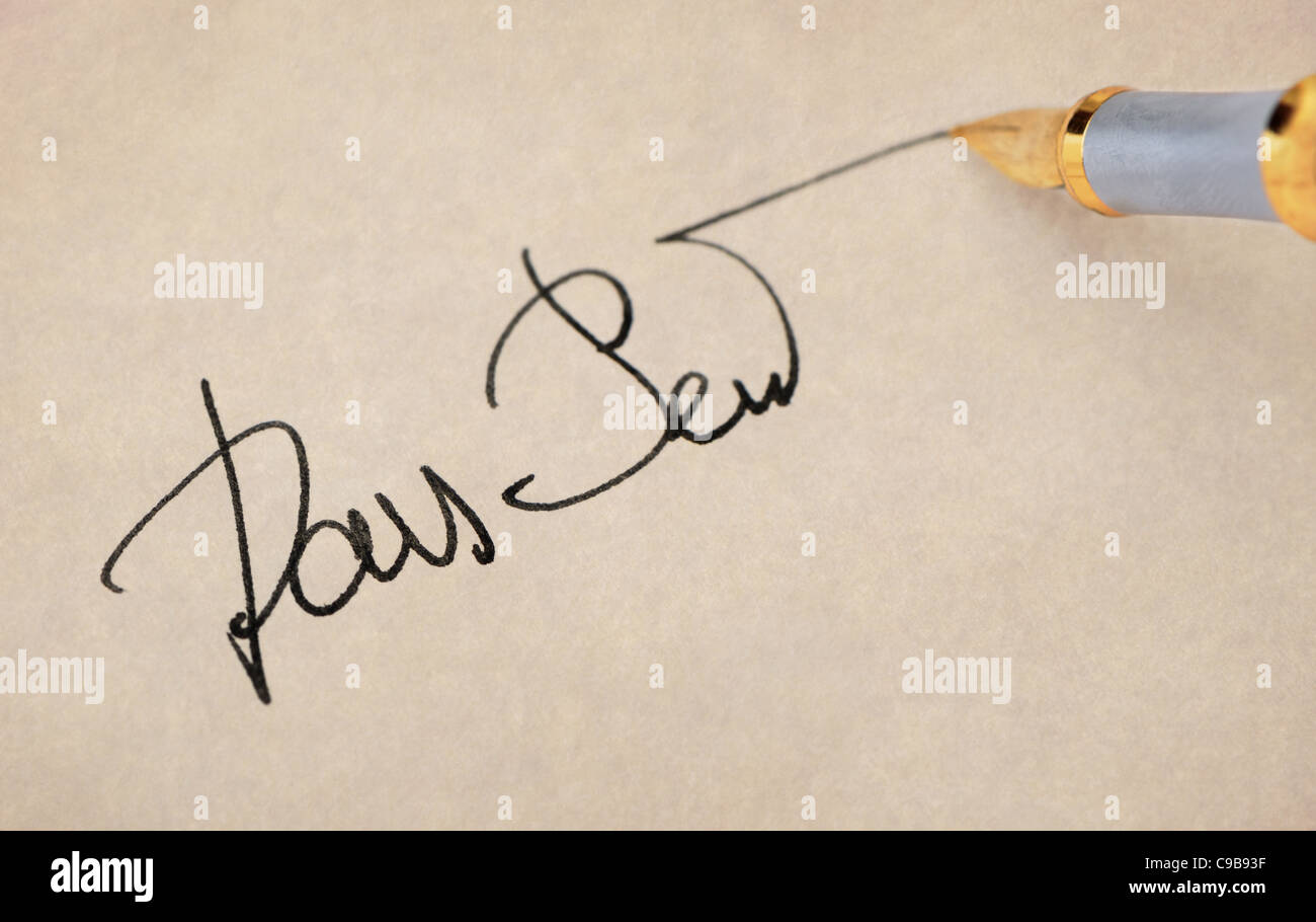 The signature close up and fountain pen.Old yellow paper. Selective ...