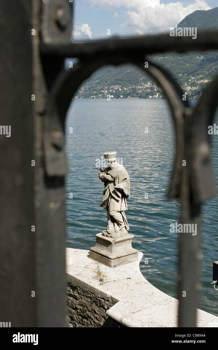 A cleric statue by lake Como, Lombardy, Italy Stock Photo - Alamy
