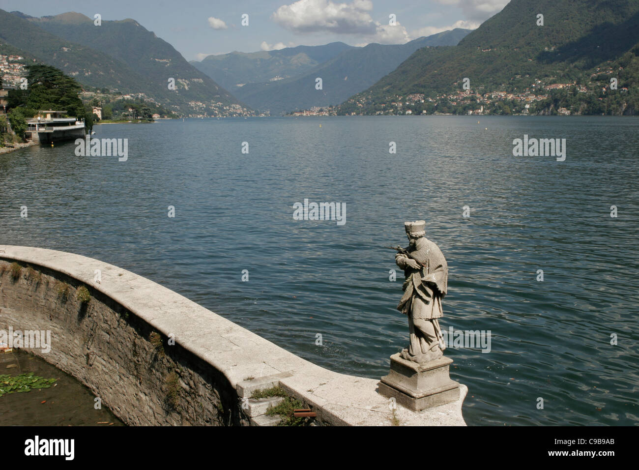 A cleric statue by lake Como, Lombardy, Italy Stock Photo - Alamy