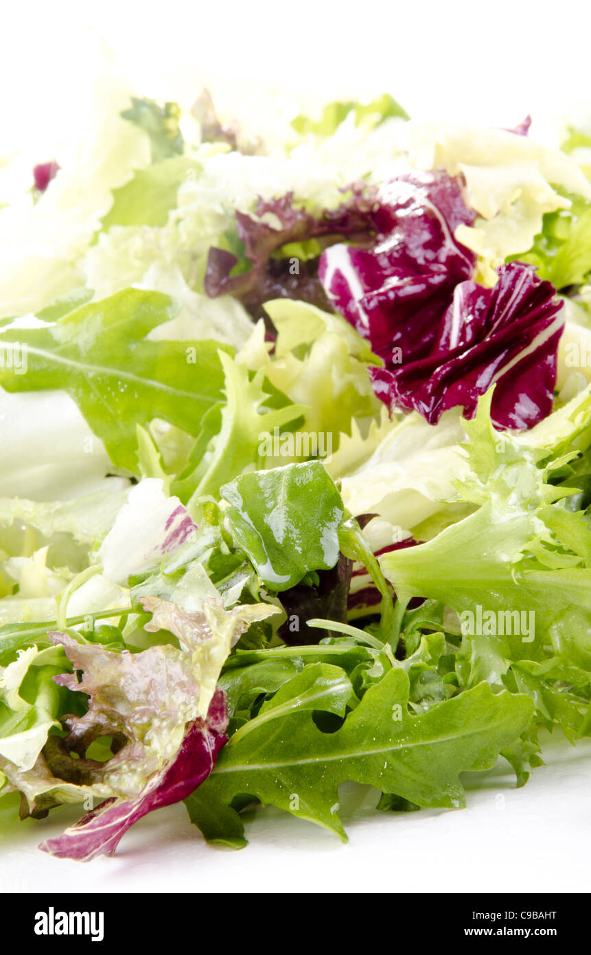 freshly washed, mixed Italian salad and a white background Stock Photo ...