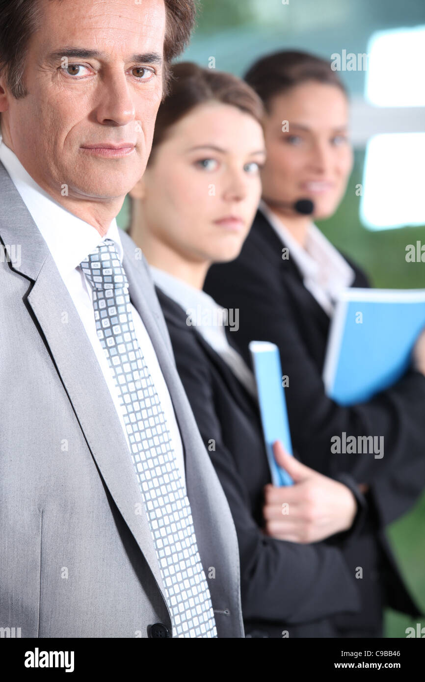 Male manager and his female team Stock Photo - Alamy