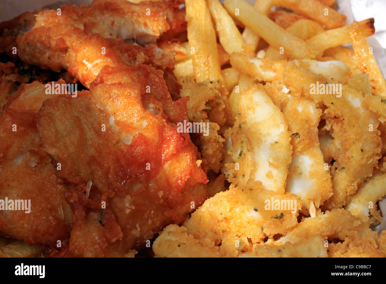 Fish, chips and calamari in paper wrapping from restaurant at Kalk Bay ...