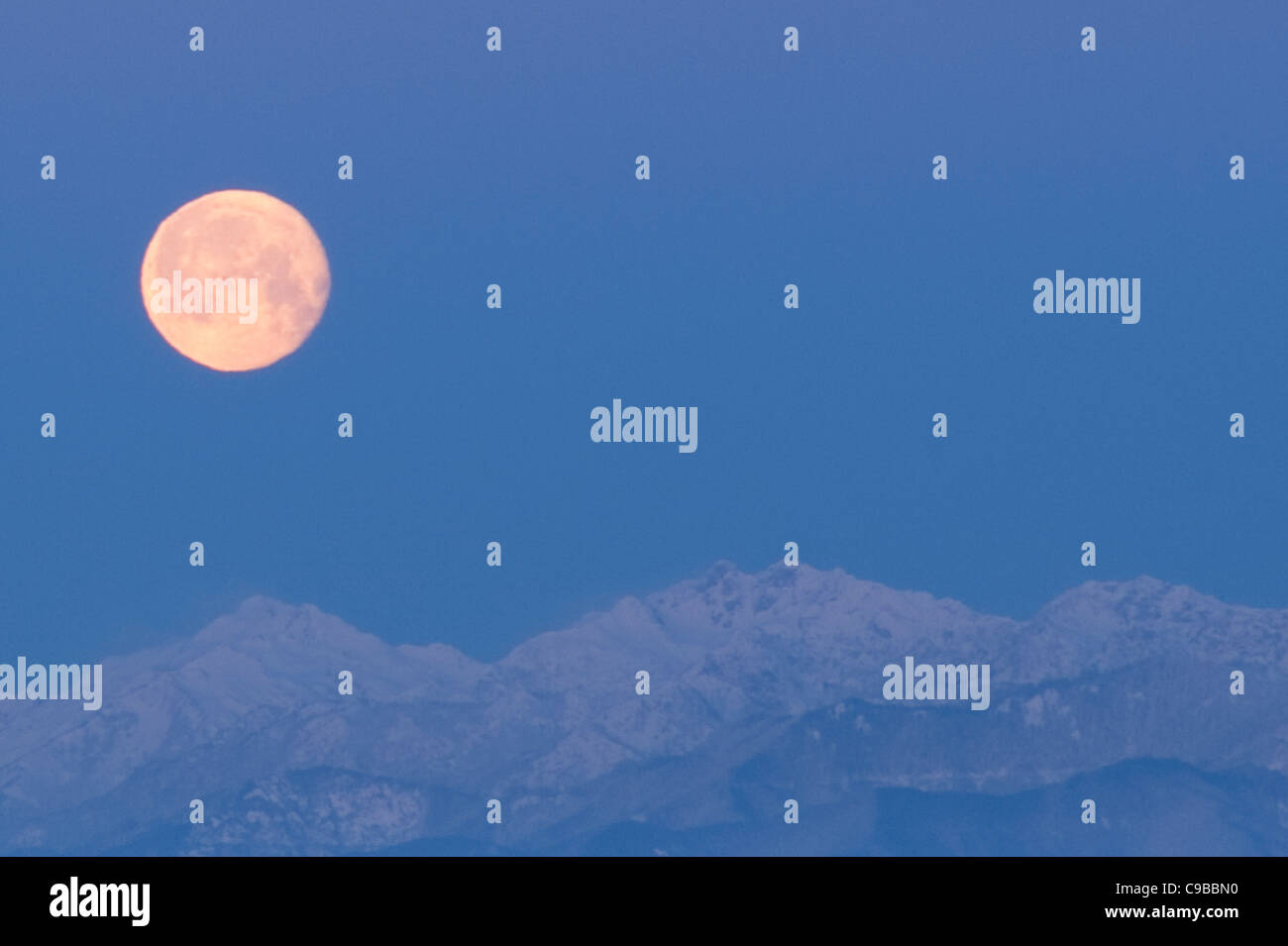 Sunrise with moon set over snow covered Olympic Mountains Stock Photo ...