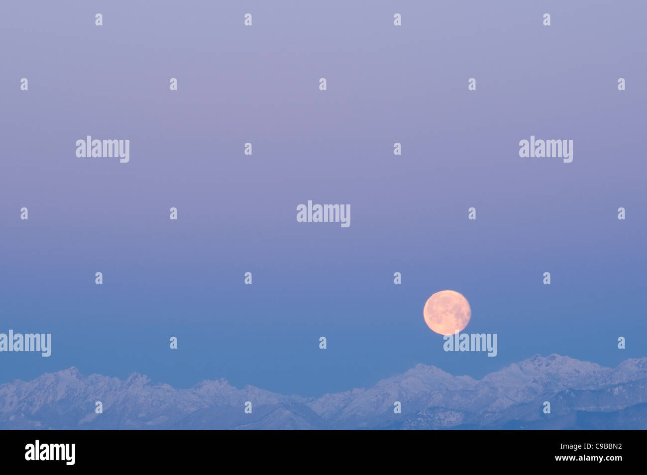 Sunrise with moon set over snow covered Olympic Mountains Stock Photo ...