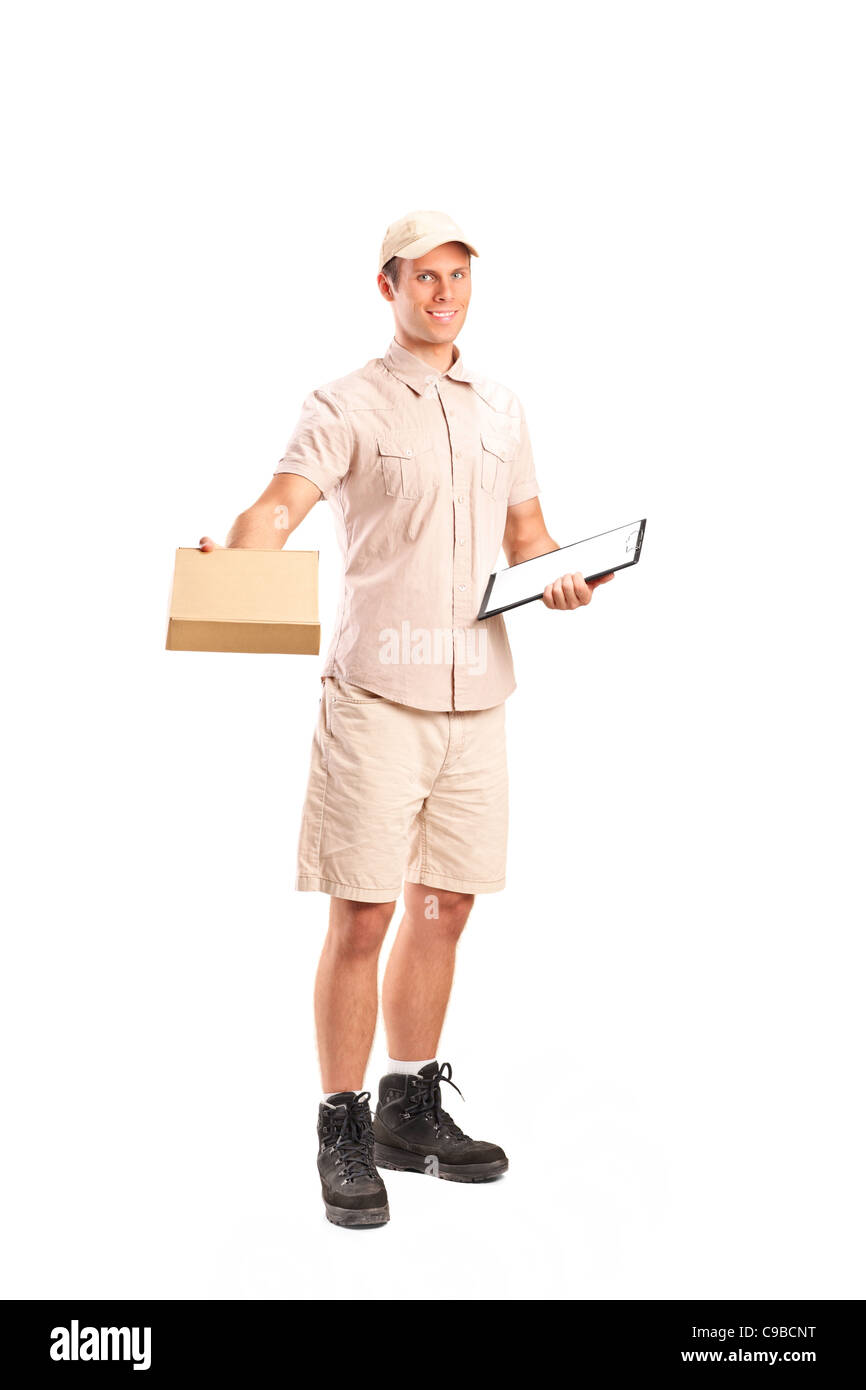 Full length portrait of a delivery boy delivering a packet and holding ...