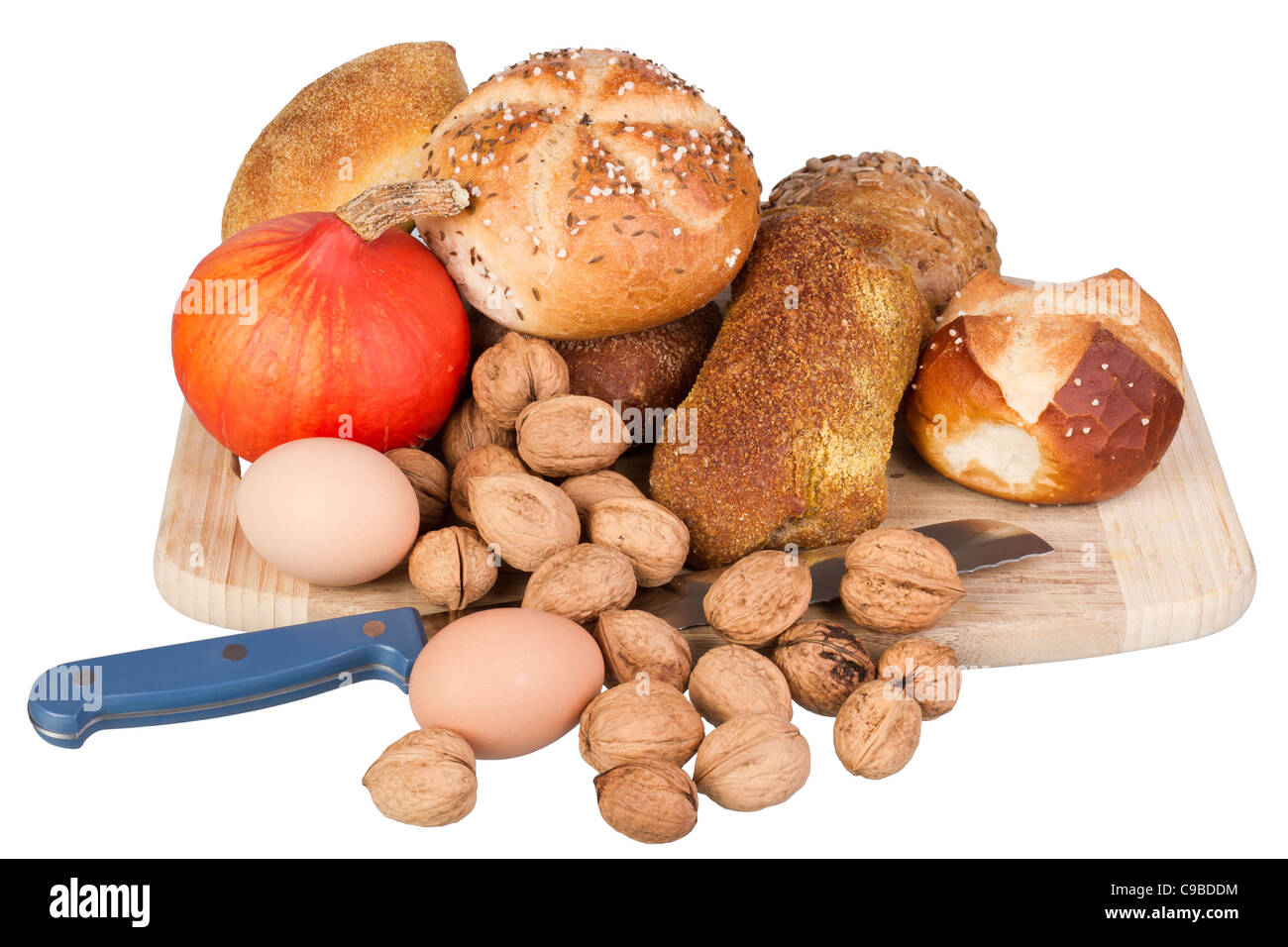 gem, nuts, eggs and a pumpkin on a wooden board. isolated on white ...