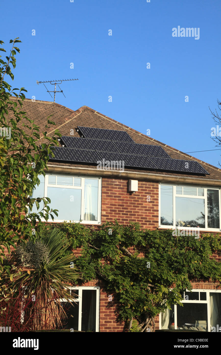 Solar Electricity Collector Panels on a House roof Stock Photo - Alamy