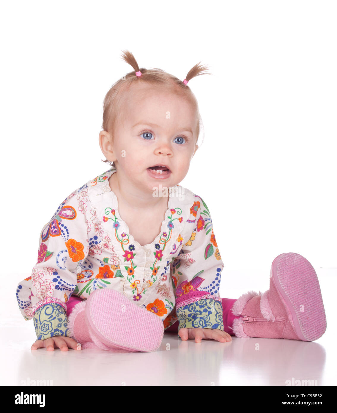 Image of a baby sitting down Stock Photo - Alamy
