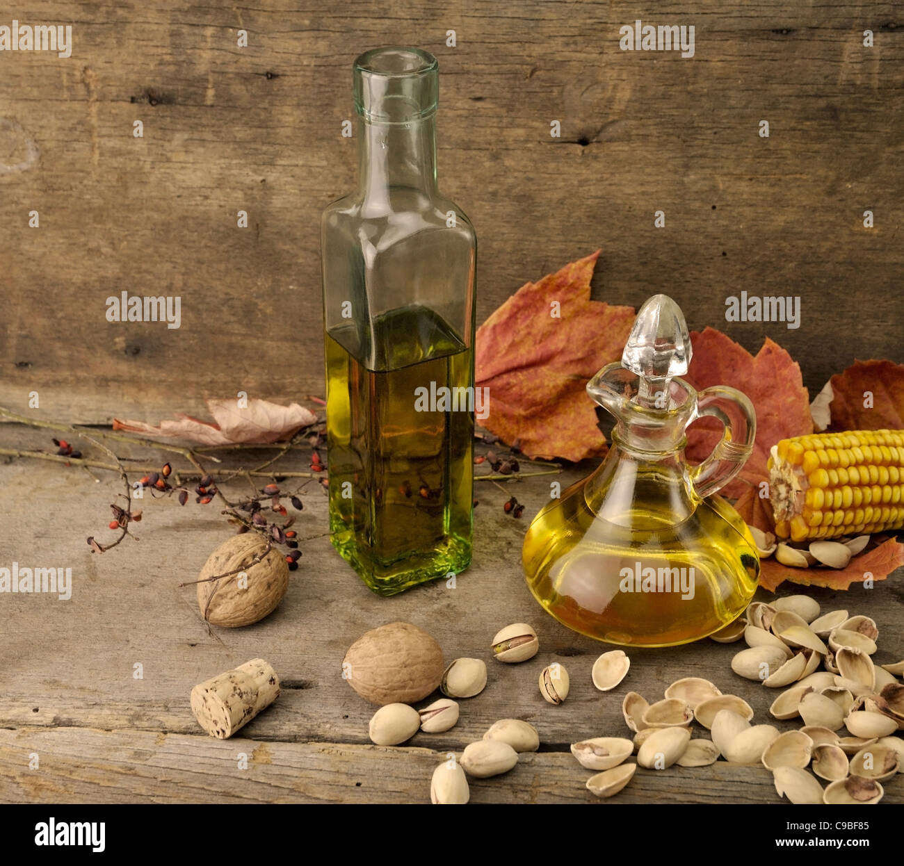 Cooking Oil And Autumn Items On Wooden Background Stock Photo - Alamy