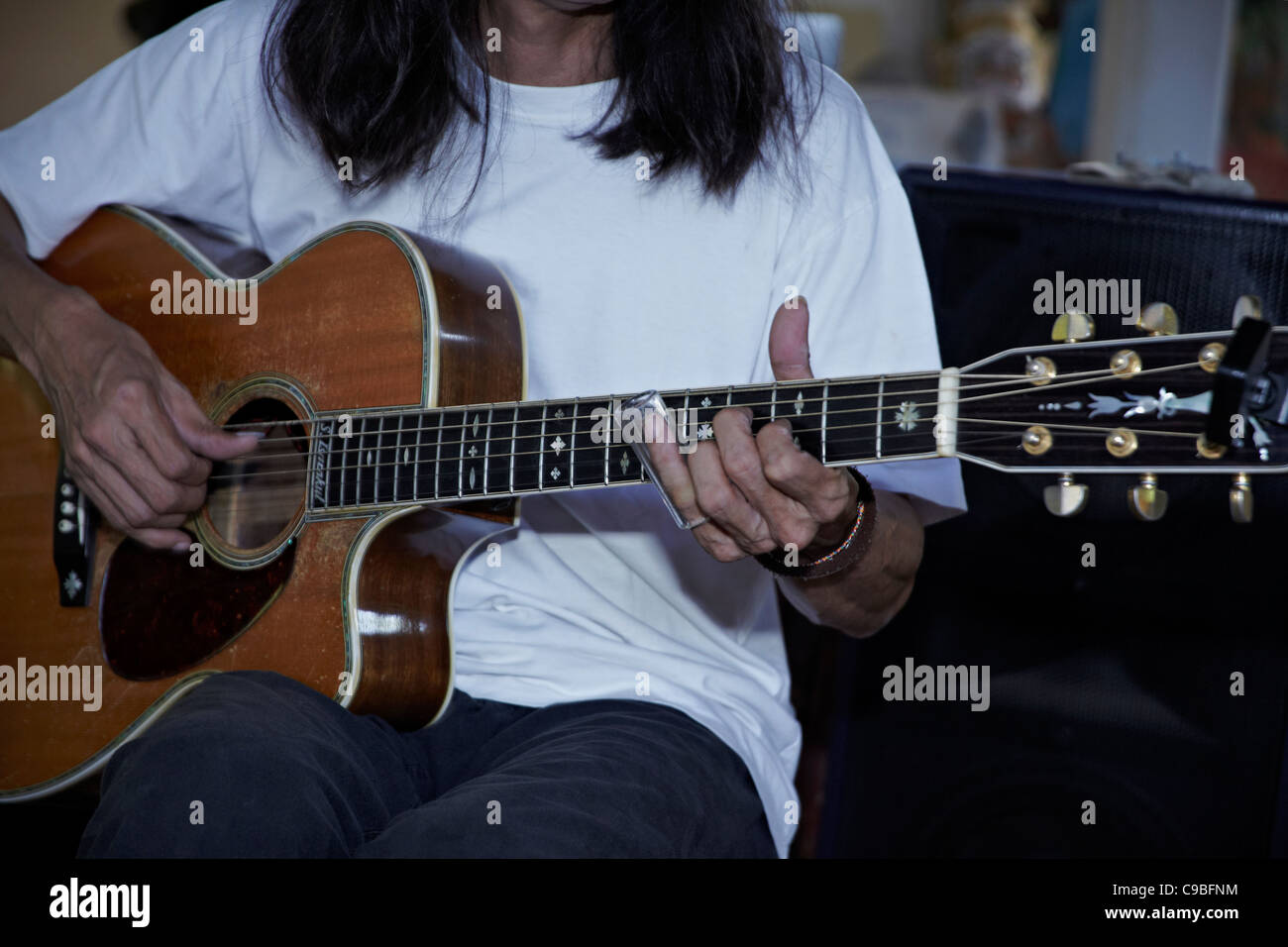 Guitar player. Man playing an acoustic guitar Stock Photo - Alamy