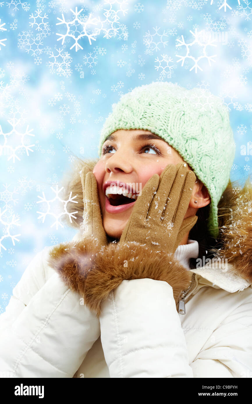 Pleasantly surprised young woman smiles looking up Stock Photo - Alamy