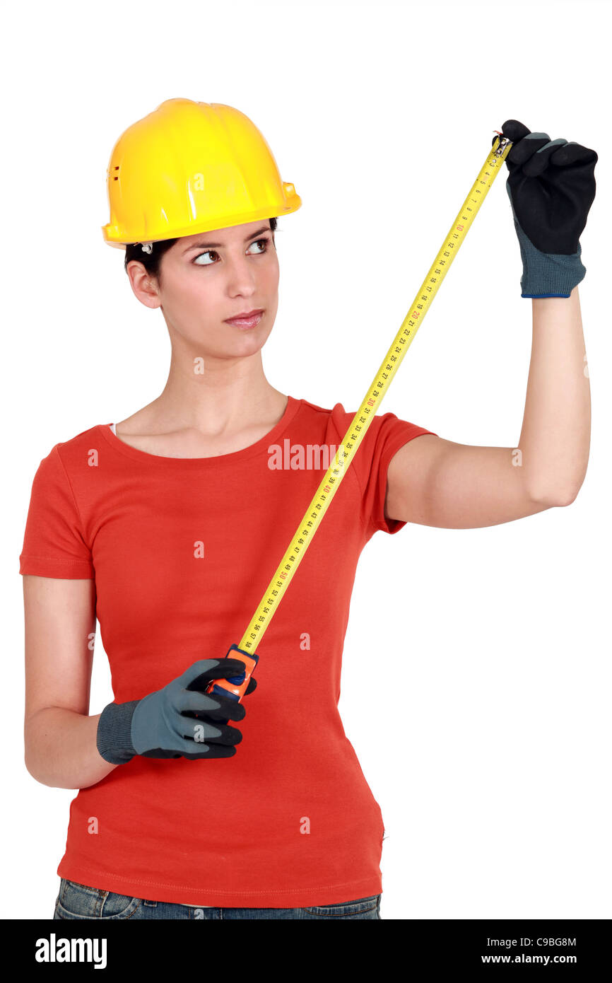 craftswoman holding a meter Stock Photo - Alamy