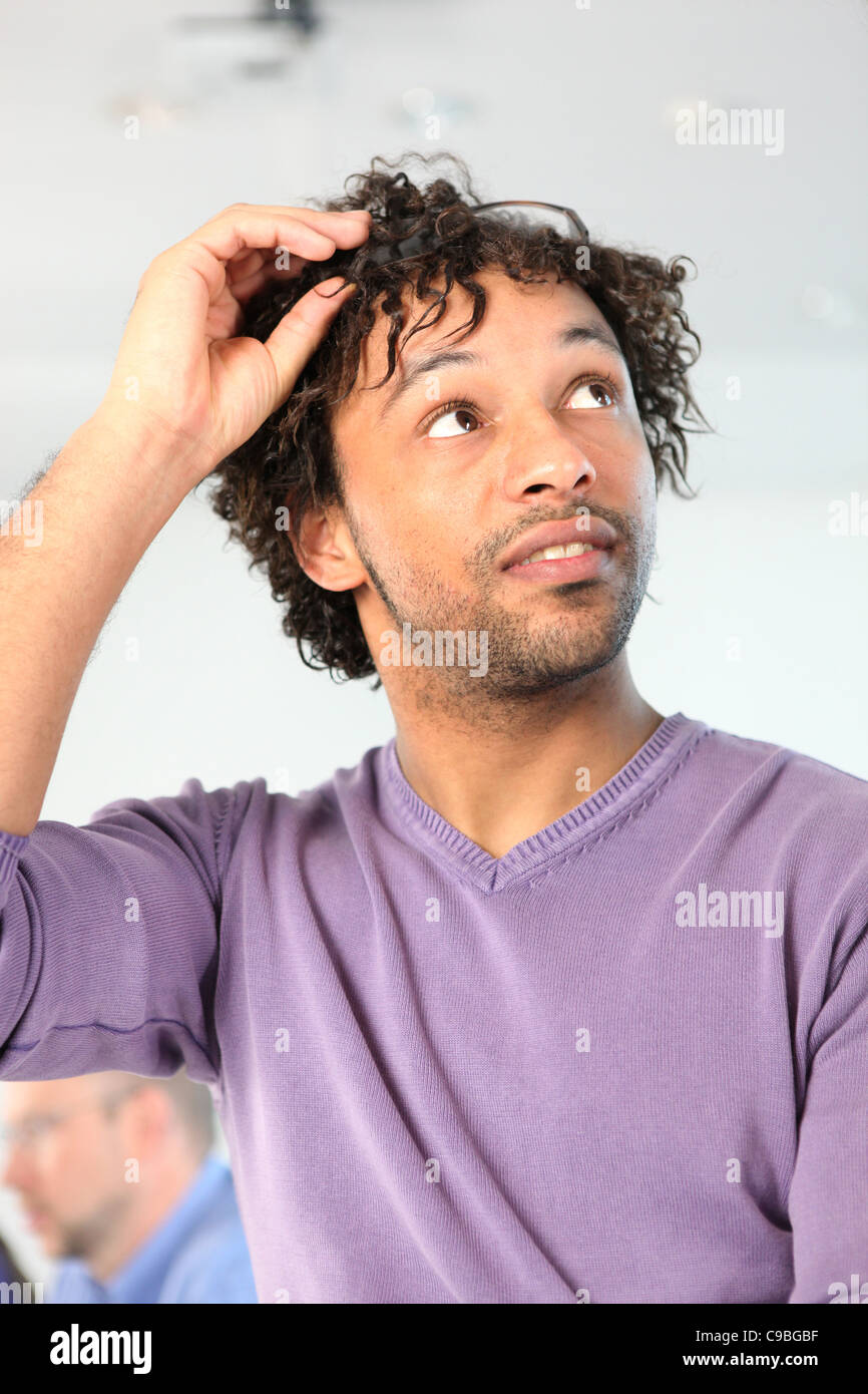 Man with stubble putting his glasses on his head Stock Photo - Alamy