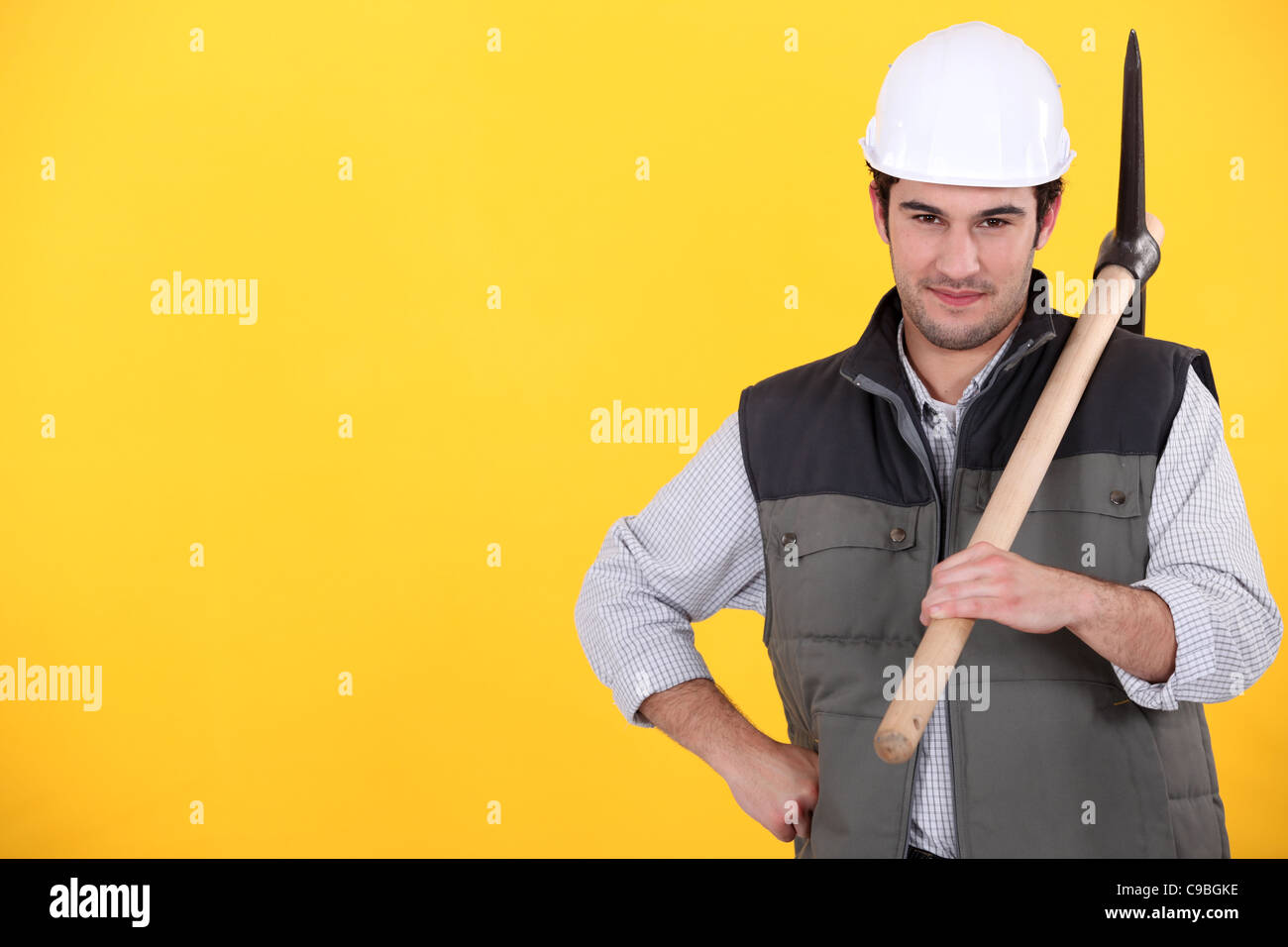 Man with pick-axe Stock Photo - Alamy