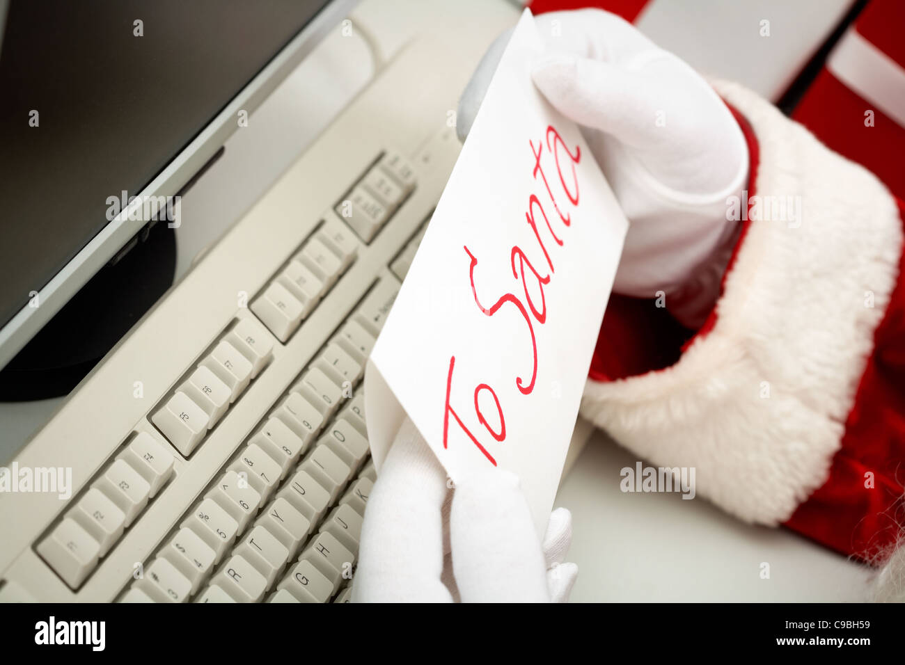 Close-up of Santa hands holding letter with note ‘To Santa’ Stock Photo ...