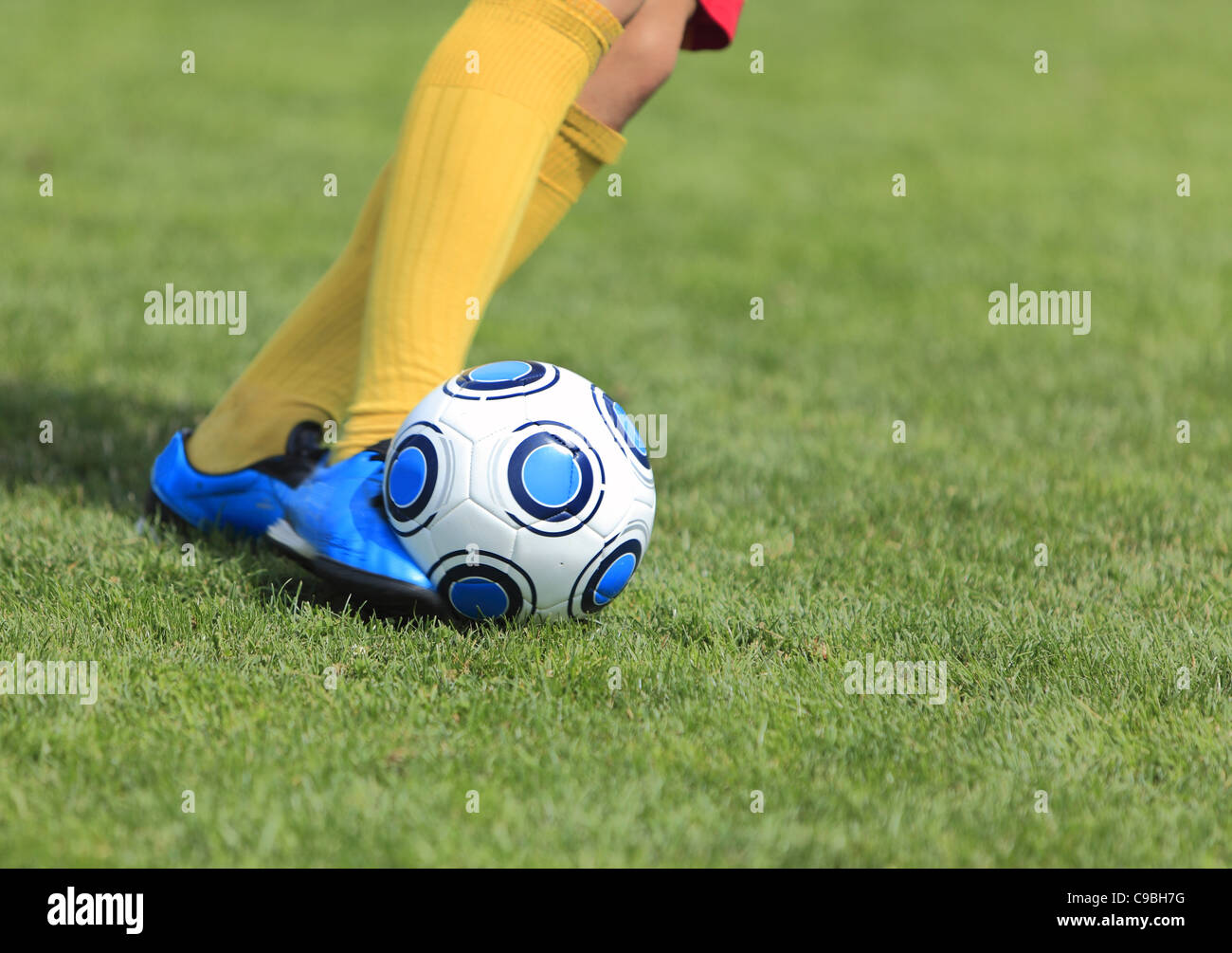 Detail image of a soccer player's leg when is kicking the ball Stock ...