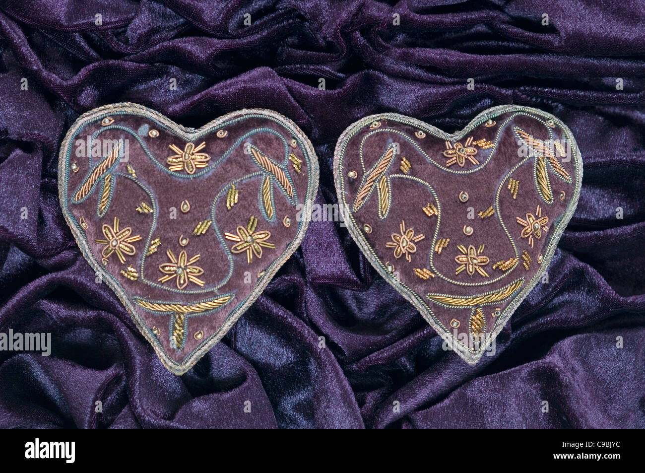 Heart shape with embroidery on velvet Stock Photo - Alamy