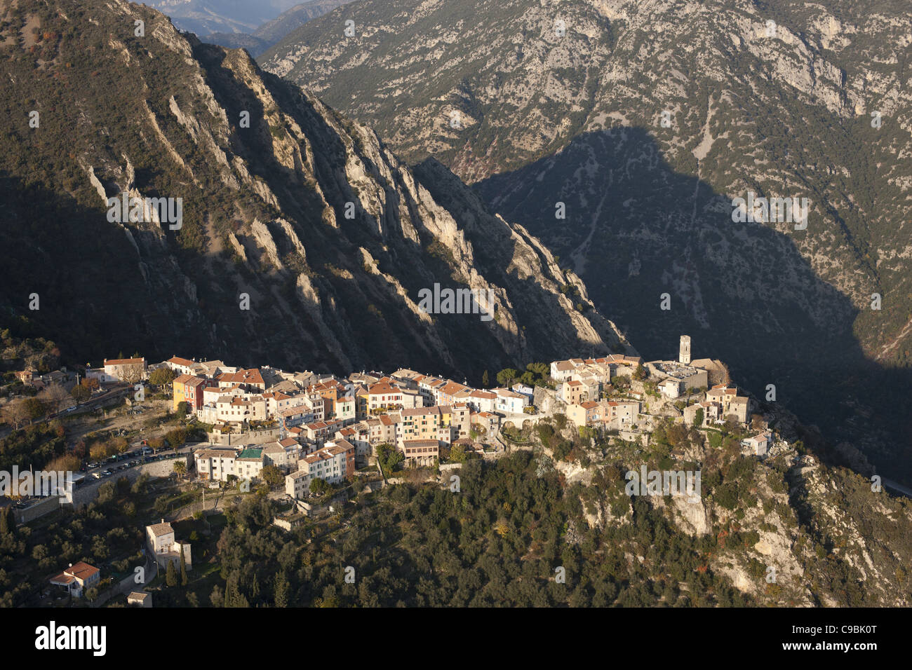 AERIAL VIEW. Perched medieval village on a rocky spur high above the ...
