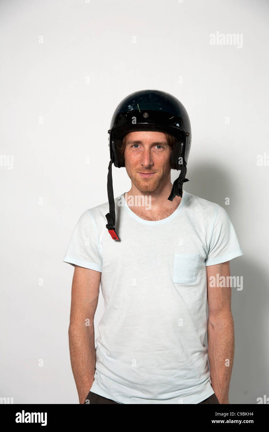 Man wearing safety helmet, smiling, portrait Stock Photo - Alamy
