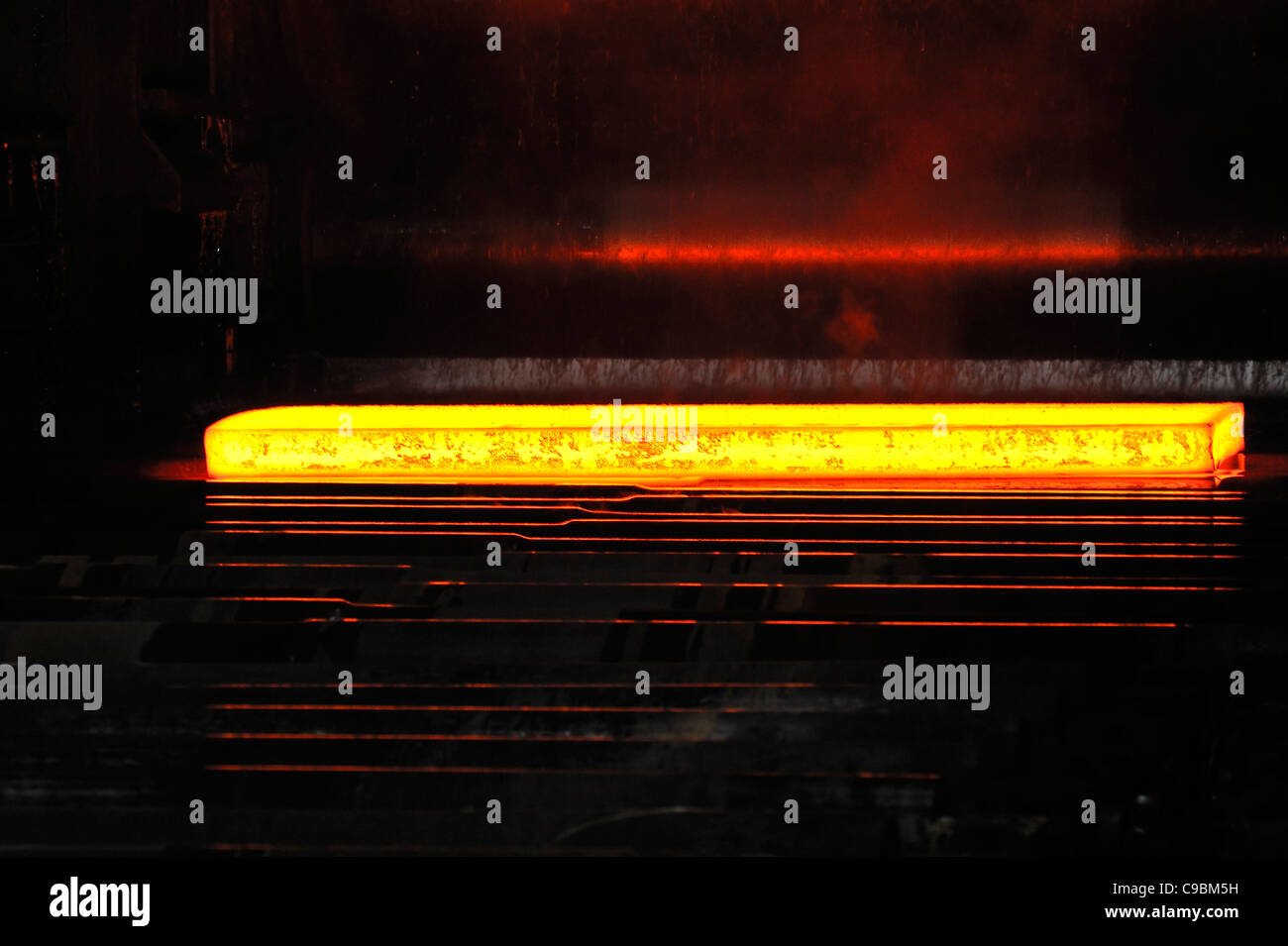 hot steel on conveyor Stock Photo - Alamy
