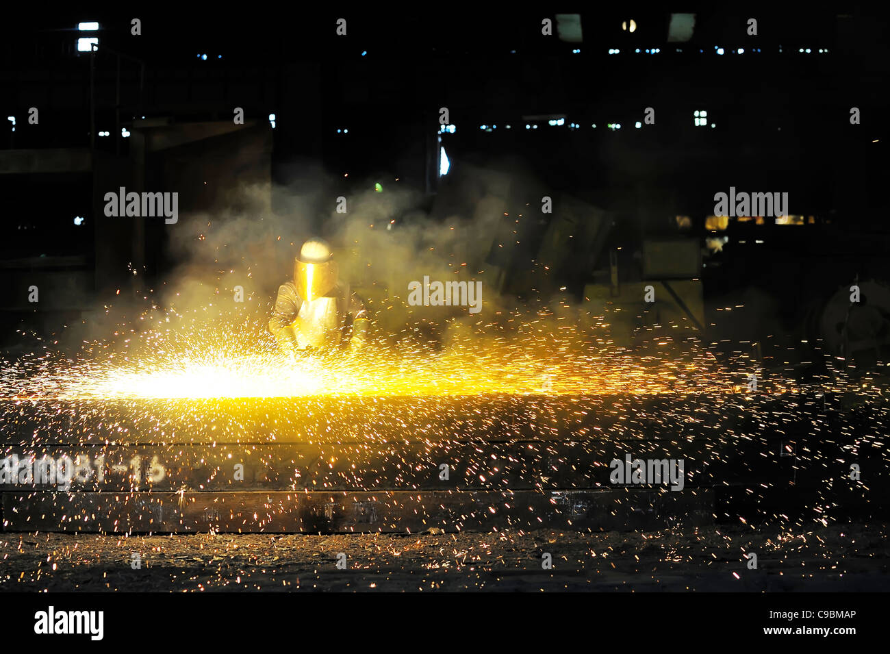 worker using torch cutter to cut through metal Stock Photo - Alamy