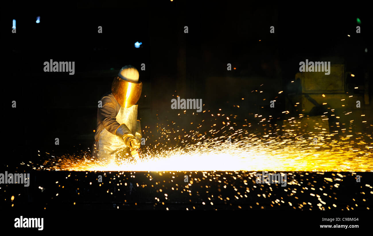 worker using torch cutter to cut through metal Stock Photo - Alamy