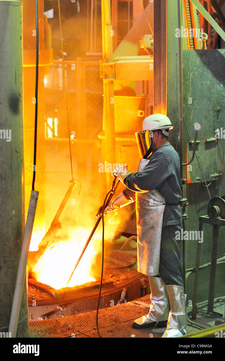 mill worker with hot steel Stock Photo - Alamy