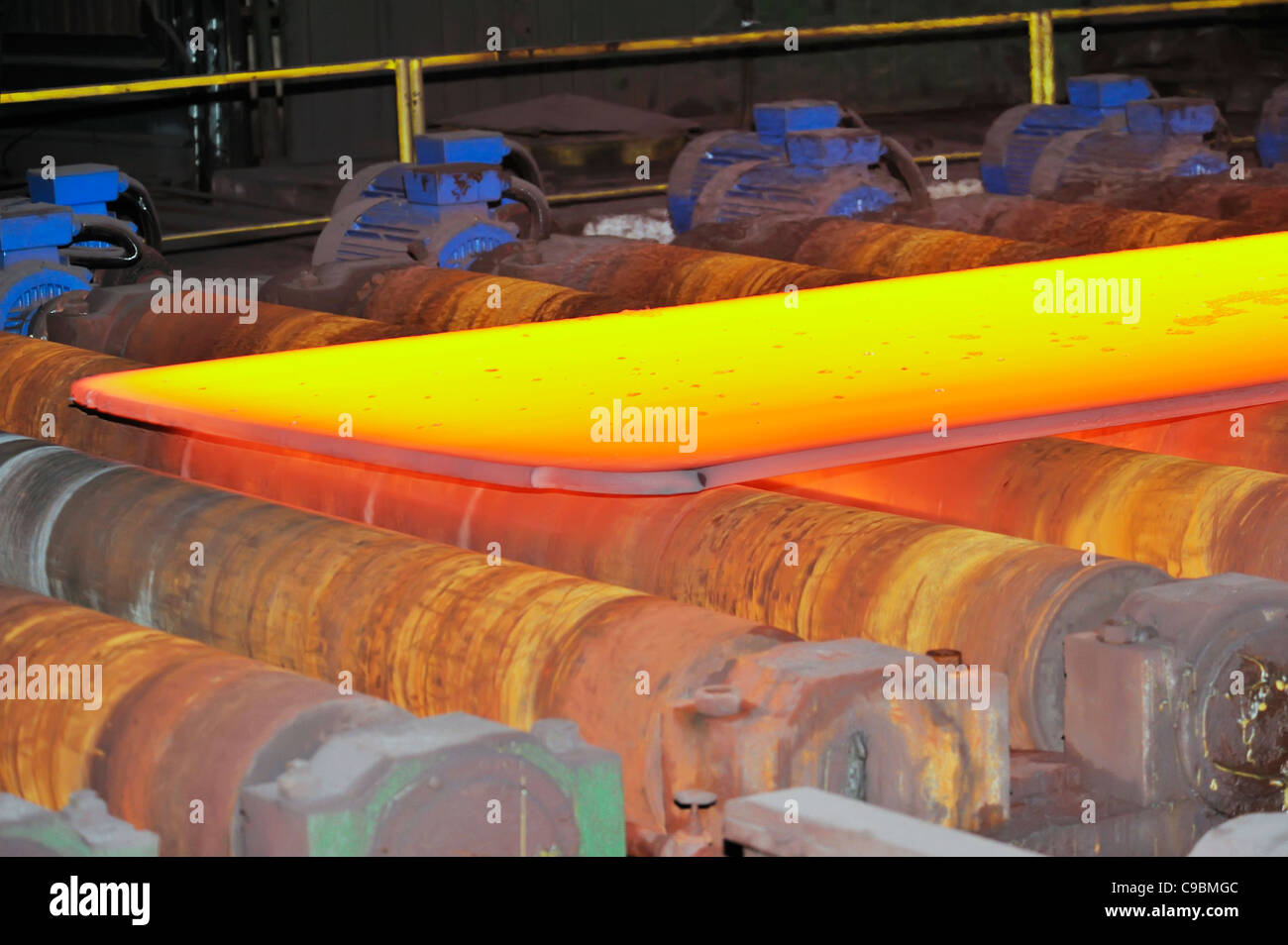 hot steel on conveyor Stock Photo - Alamy