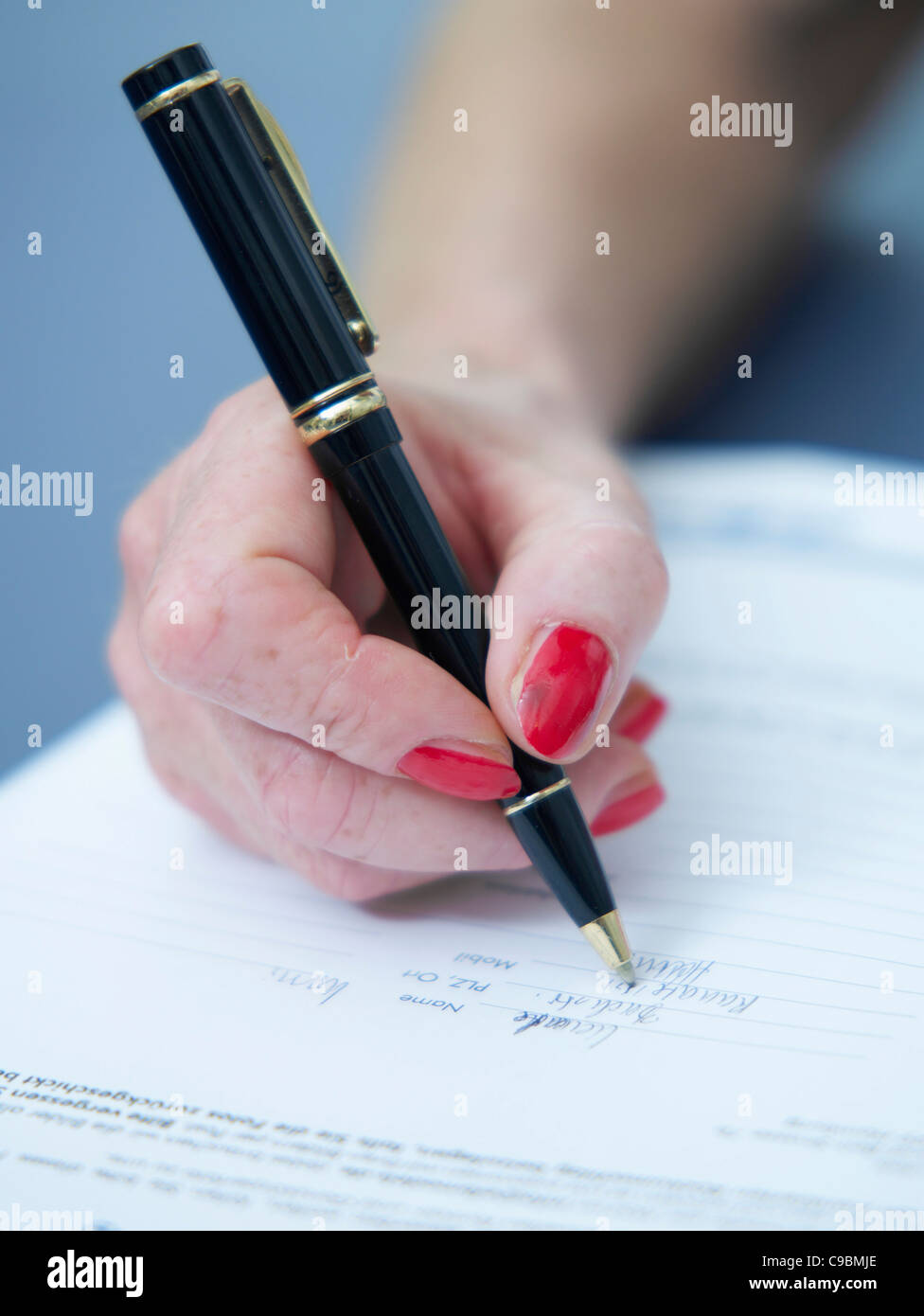 Woman writing document Cut Out Stock Images & Pictures - Alamy
