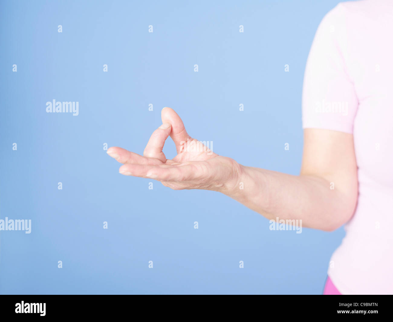 Senior woman in lotus position, close up Stock Photo - Alamy