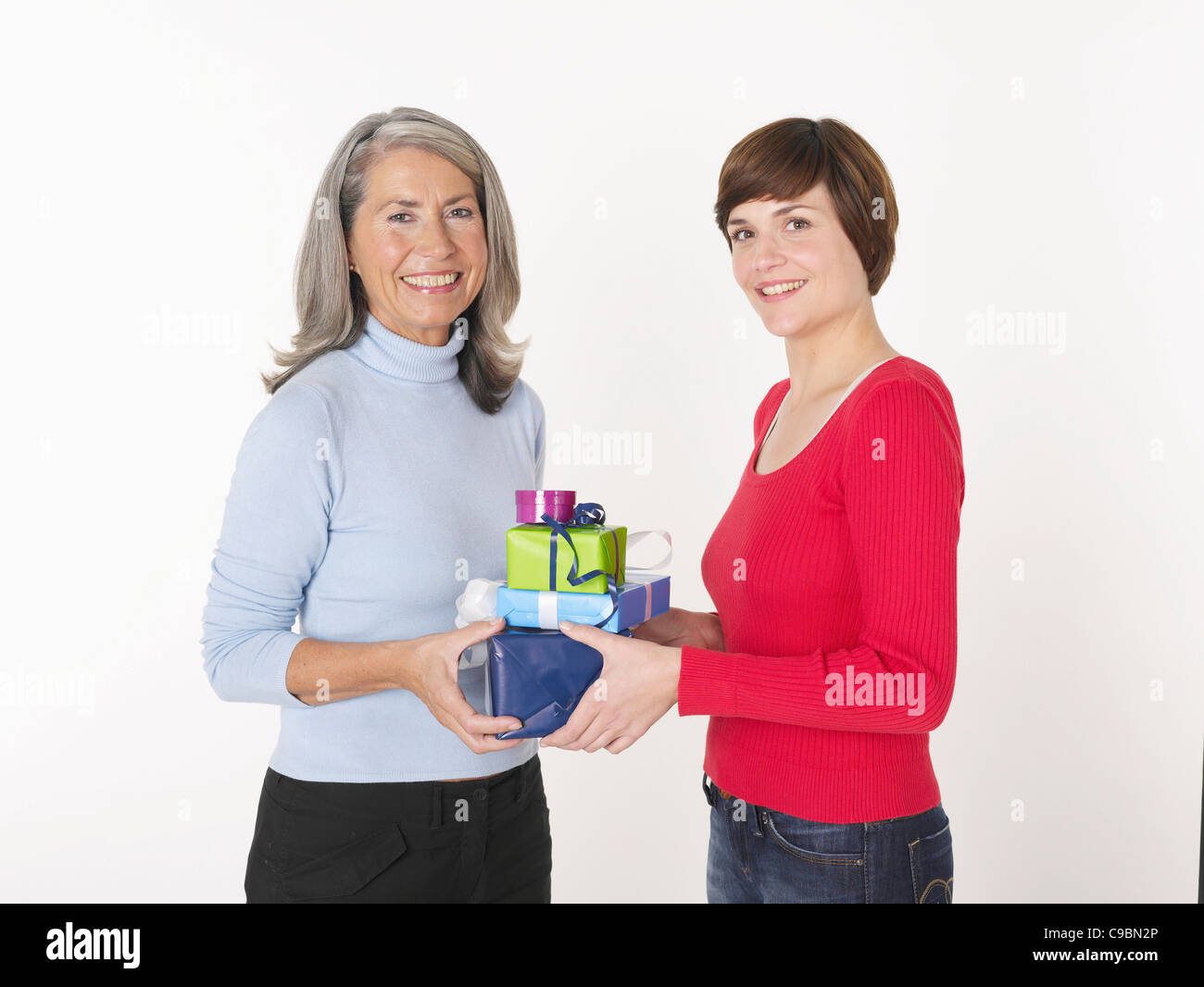 Daughter giving present to her mother Stock Photo - Alamy