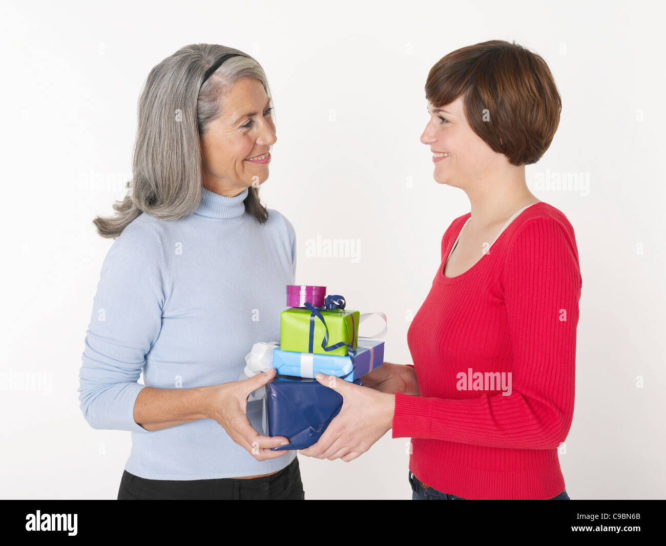 Daughter giving present to her mother Stock Photo - Alamy