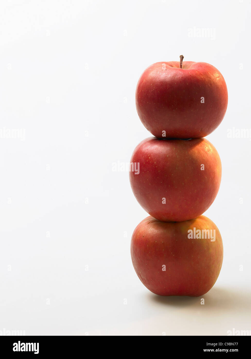 Stacked apples on white background Stock Photo - Alamy