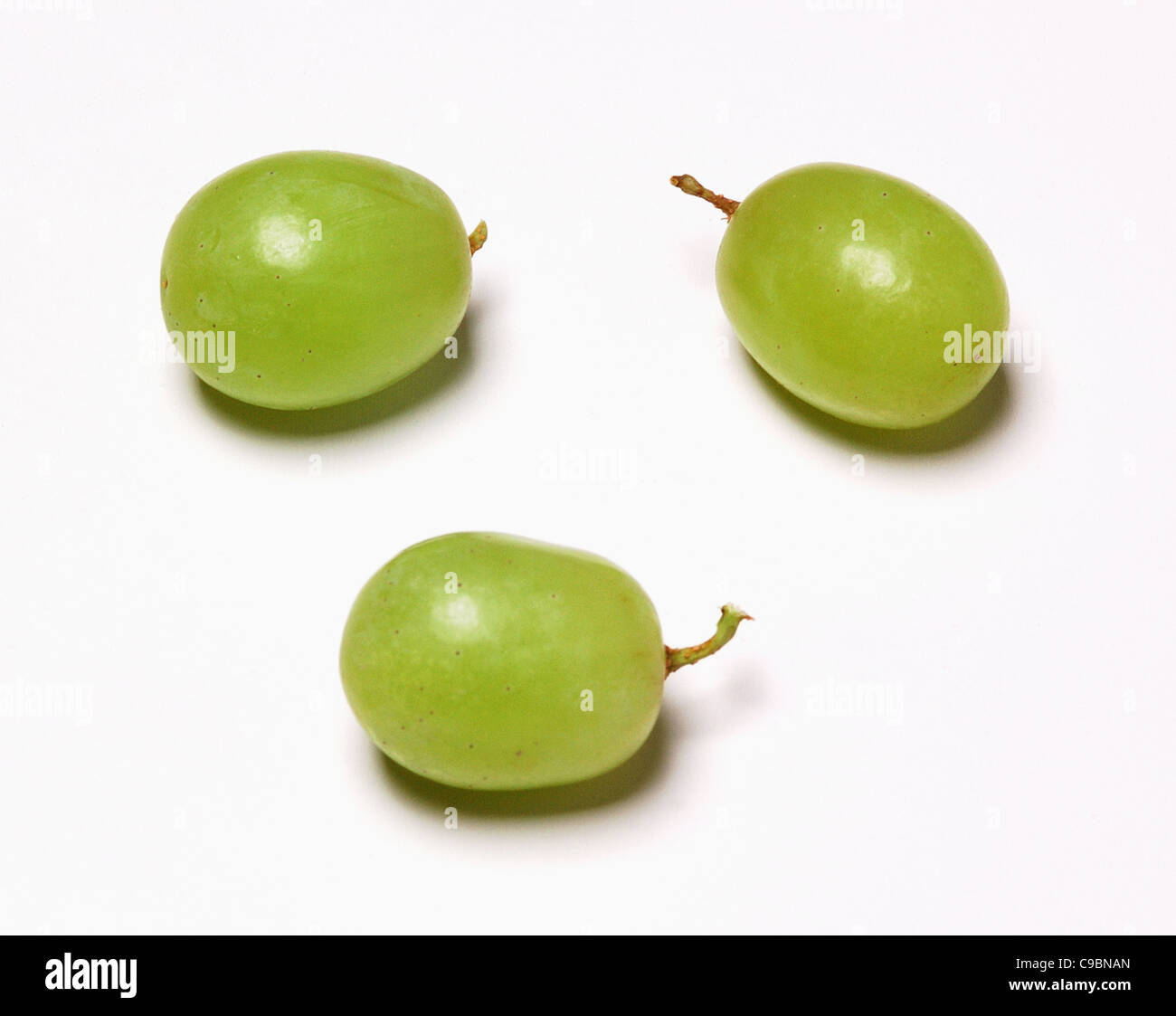 Green grapes on white background Stock Photo - Alamy