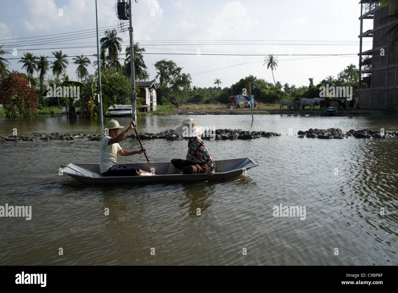 People padding , floodwaters on street at Pakkred District , Nonthaburi ...