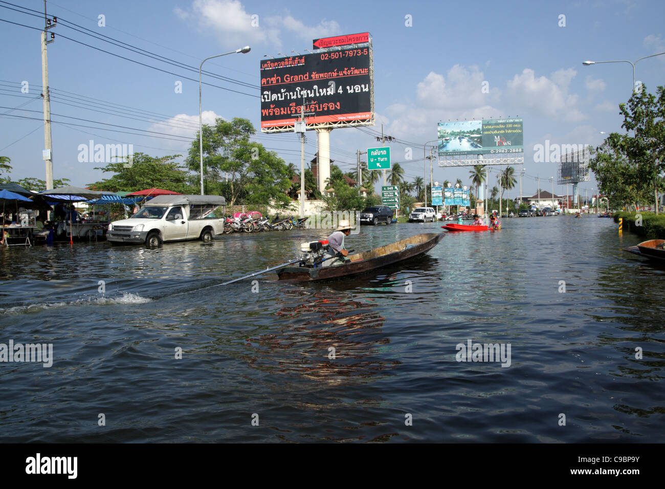 Motor boat , Floodwaters near a village at Pakkred , Nonthaburi ...