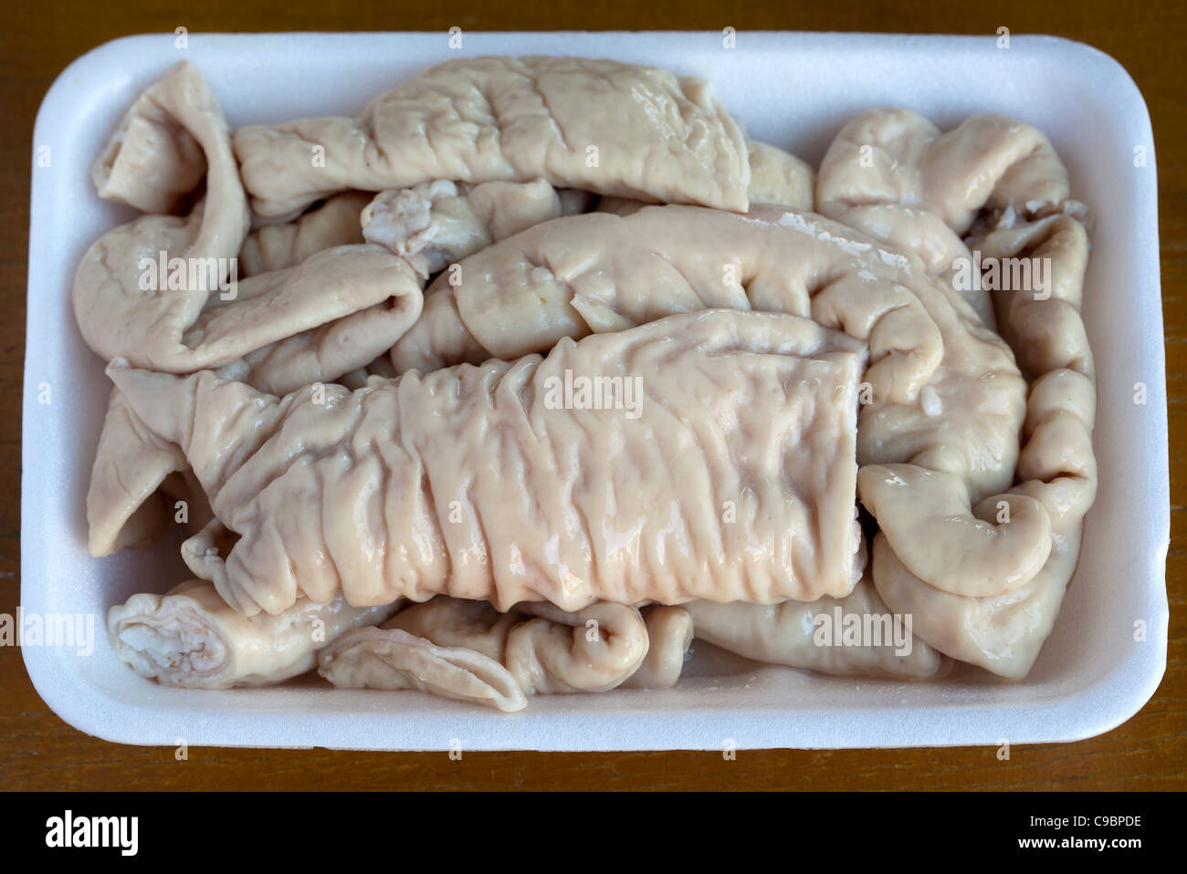 Raw pigs intestine or Chitterlings ready for cooking - An example of ...
