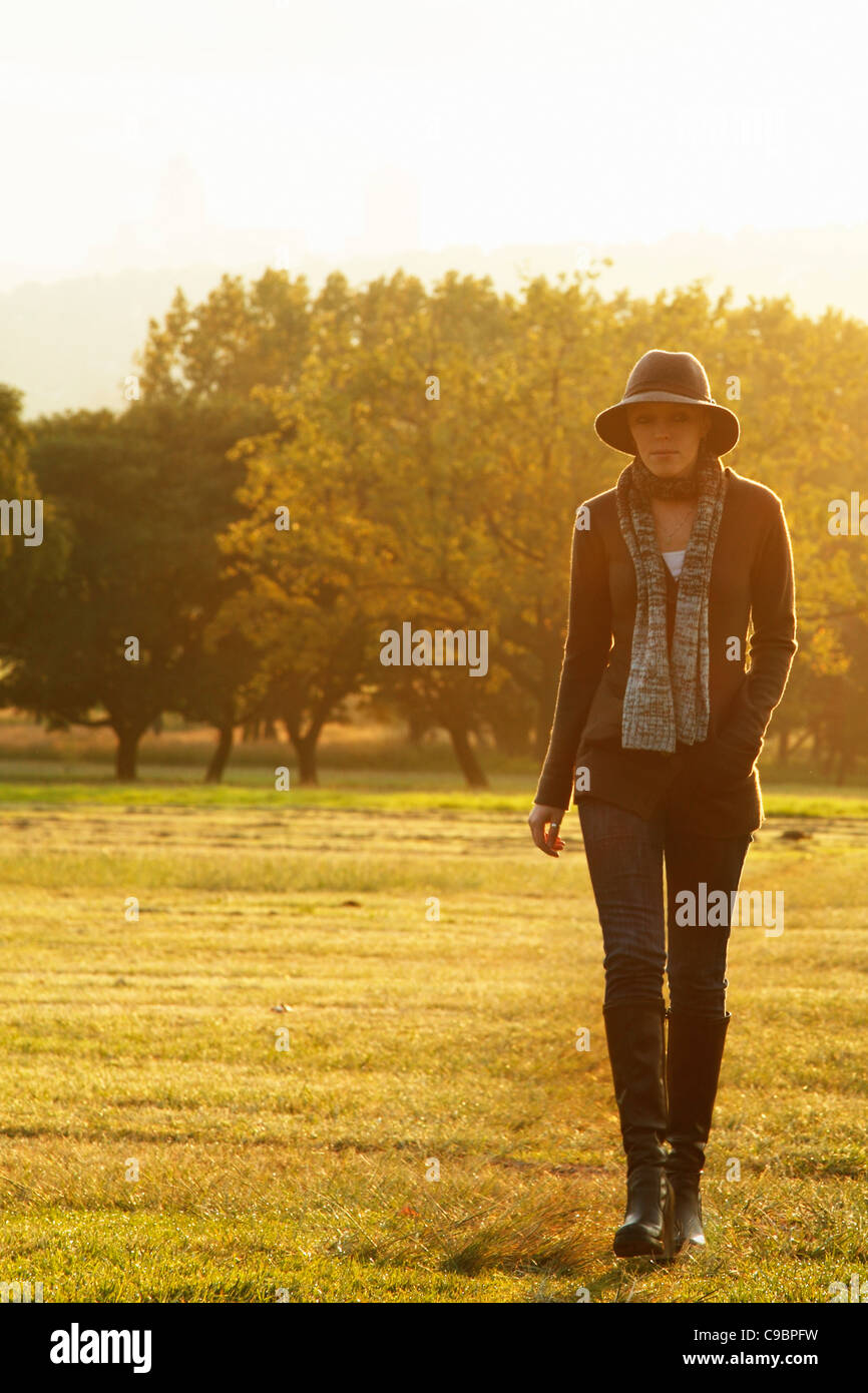 Young woman out walking on a winter morning, Johannesburg, Gauteng ...