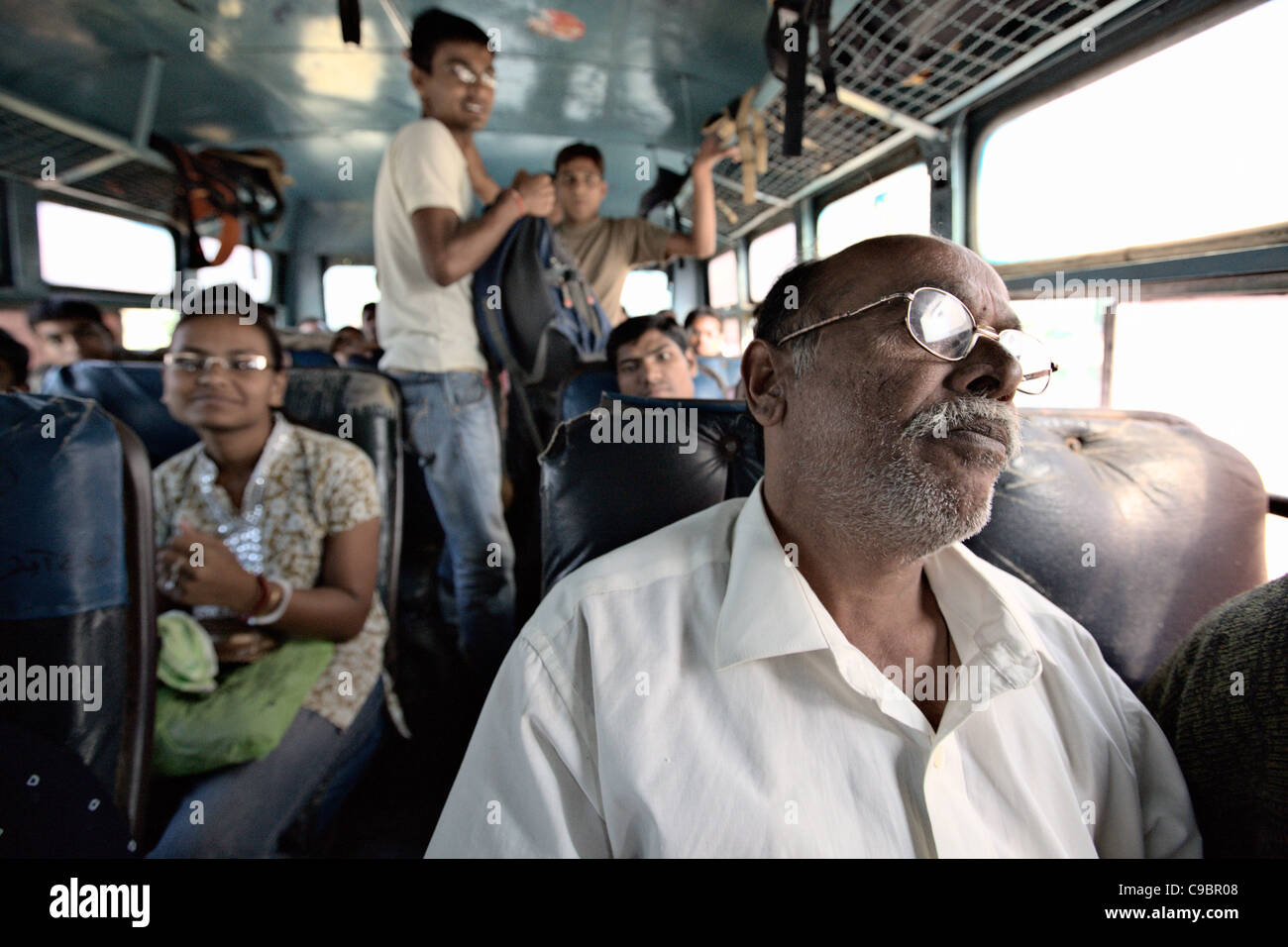 Man sleeping in local bus in Gujarat, India Stock Photo - Alamy