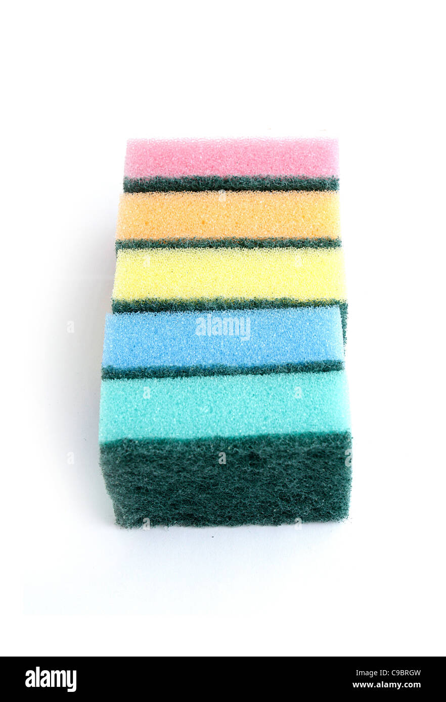 Colourful sponges isolated on a white bg Stock Photo - Alamy