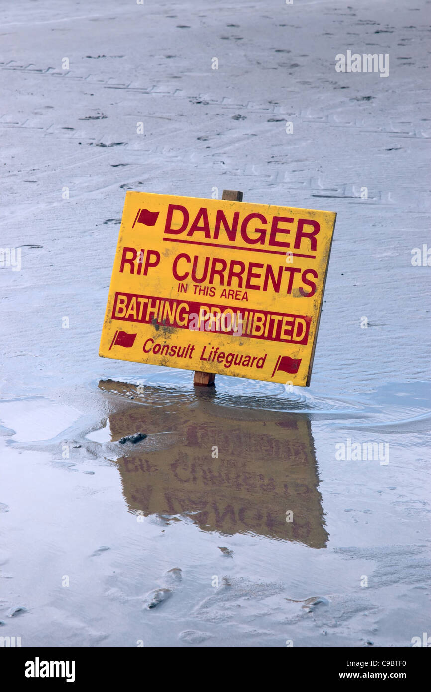 a warning sign on a beach in ballybunion ireland Stock Photo - Alamy