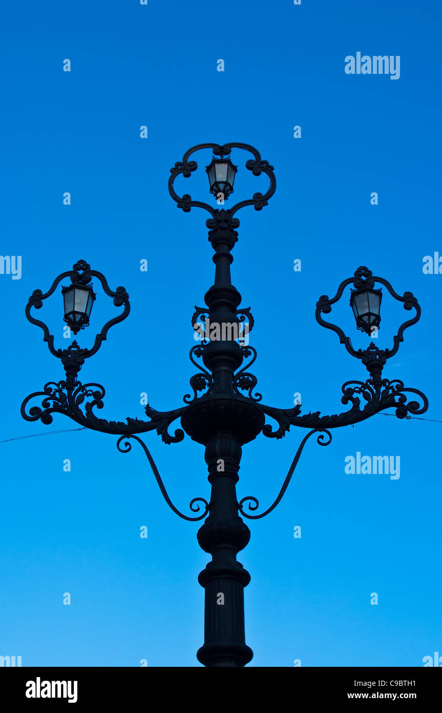 Decorated wrought iron street lamp post in Ronda, Andalucia, Spain ...