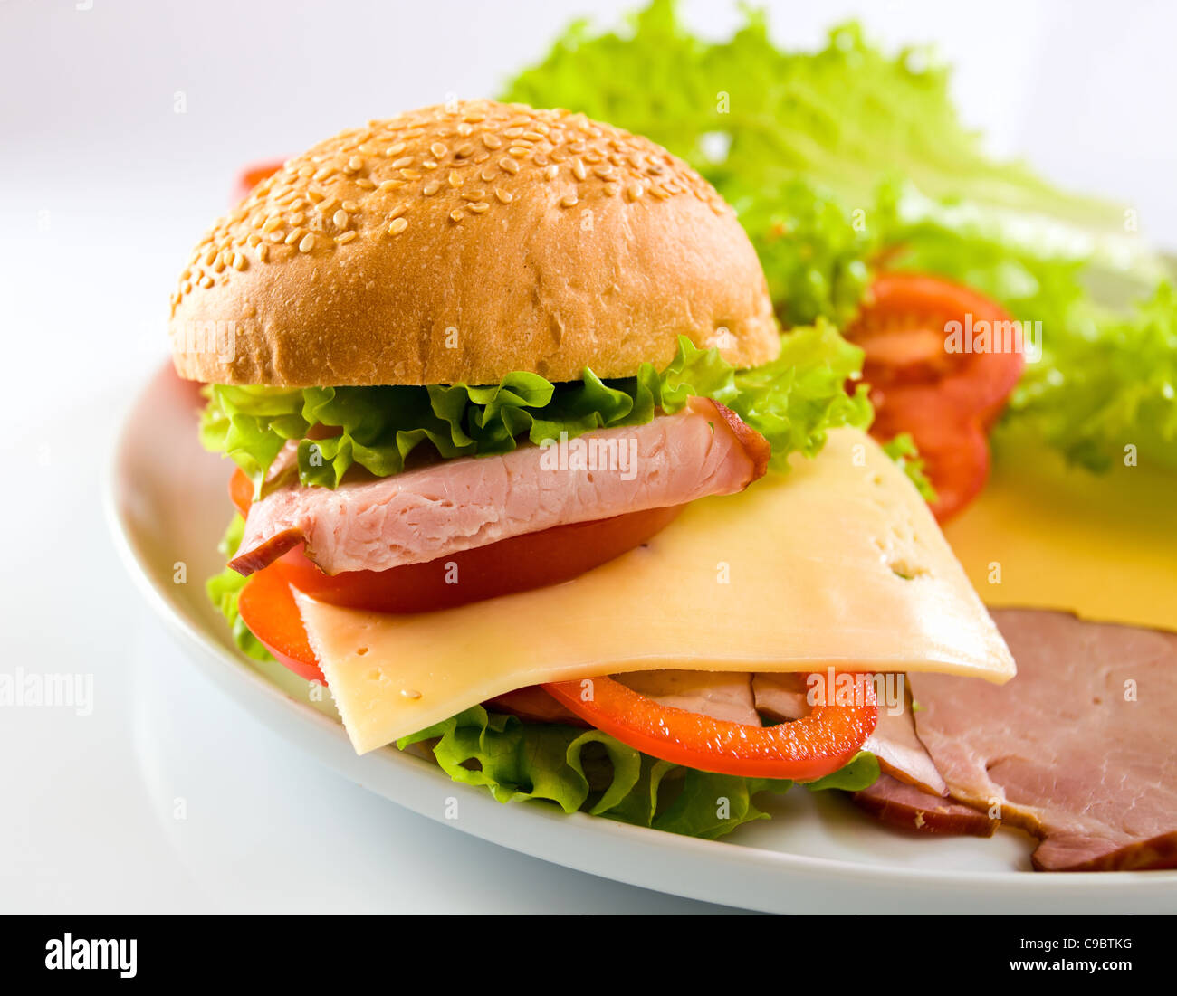 sandwich with smoked meat, cheese and red vegetables Stock Photo - Alamy
