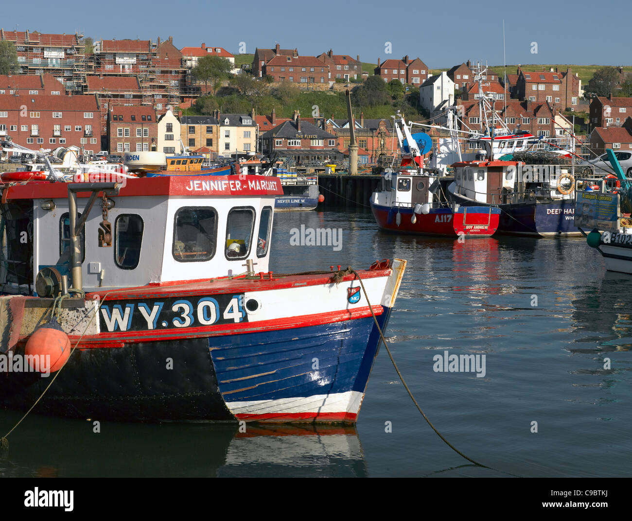 Fishing boats boat moored in Whitby harbour North Yorkshire England UK ...