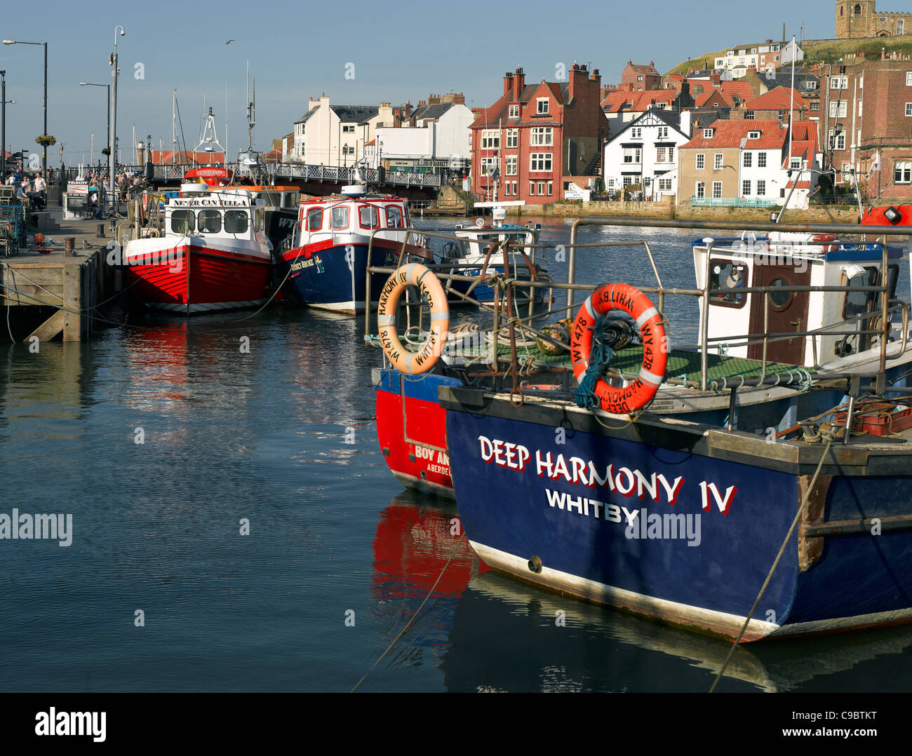 Fishing boats boat moored in Whitby harbour North Yorkshire England UK ...