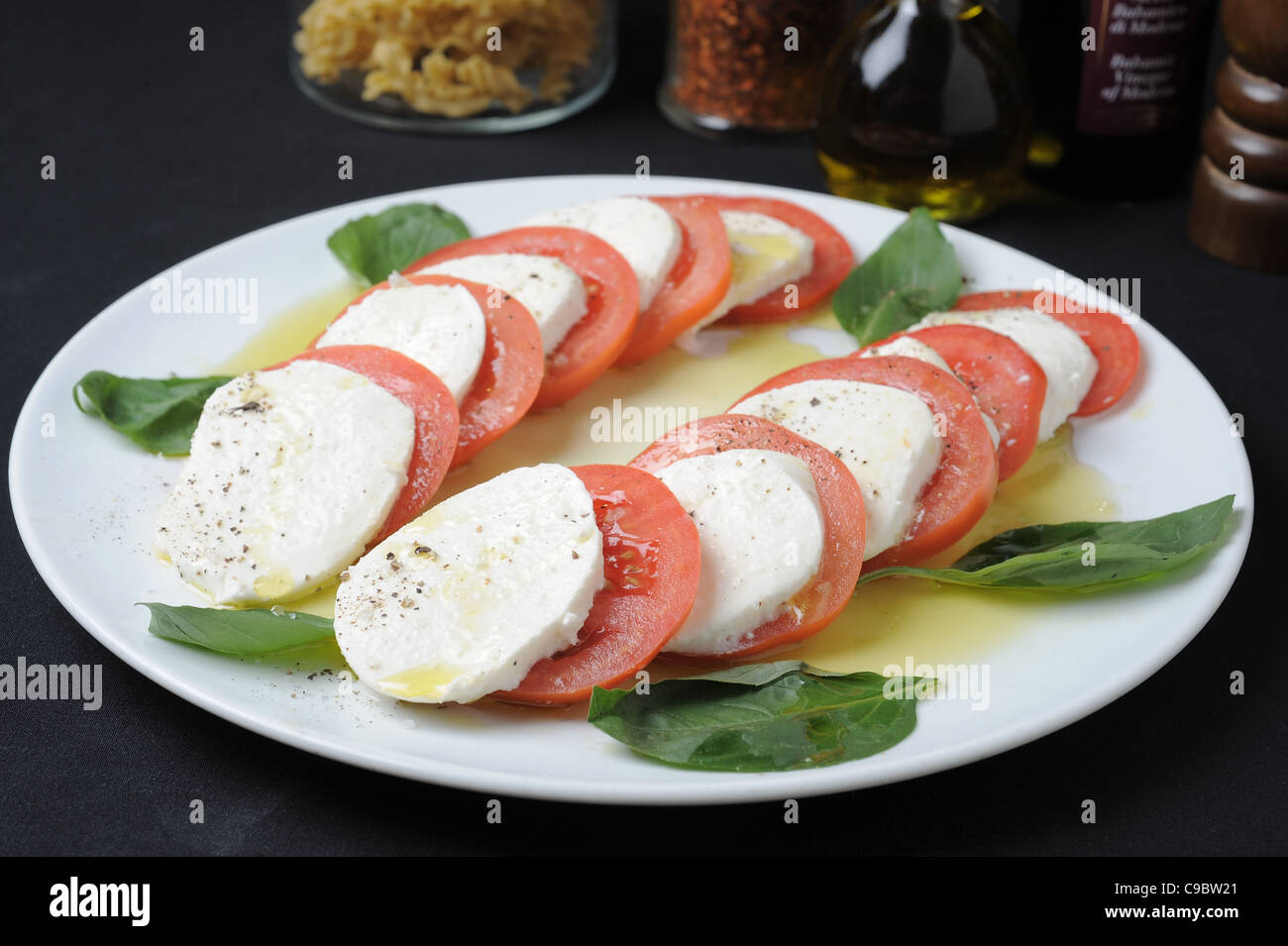 Mozzarella cheese tomatoes olive oil hi-res stock photography and ...